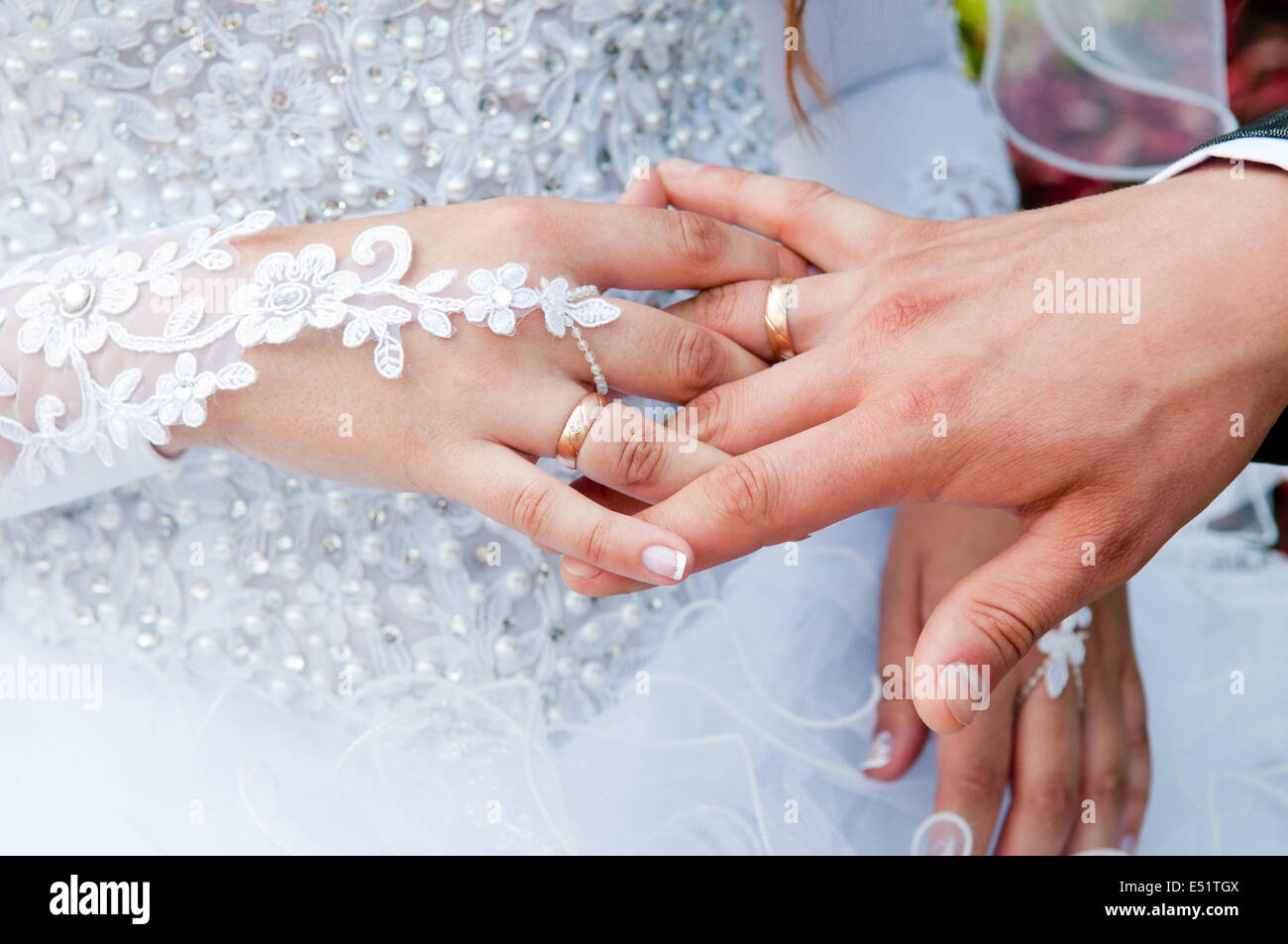 Hands with wedding rings gold Stock Photo - Alamy