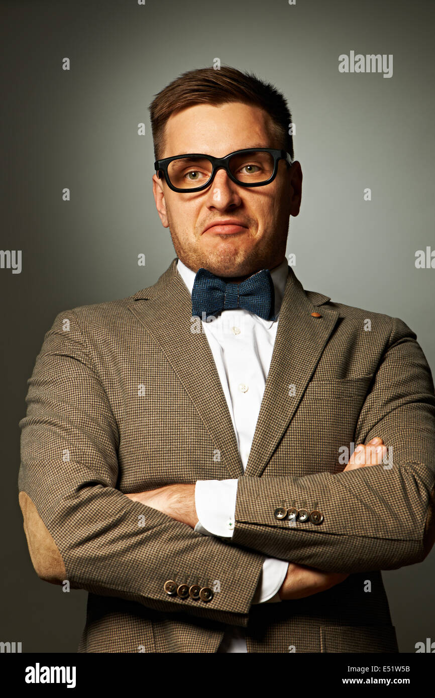 Confident nerd in eyeglasses and bow tie Stock Photo - Alamy