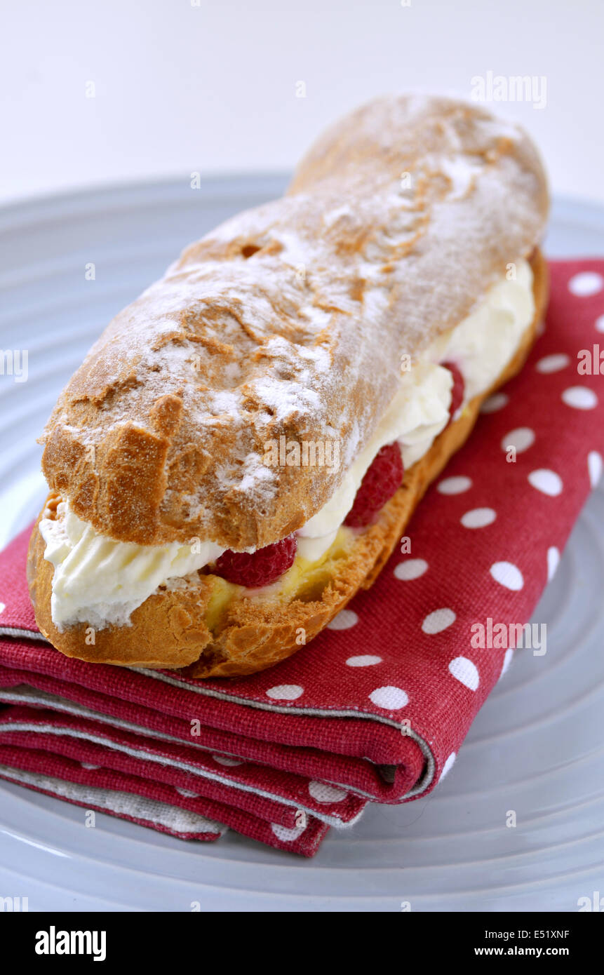 Choux pastry cream eclair slice Stock Photo - Alamy