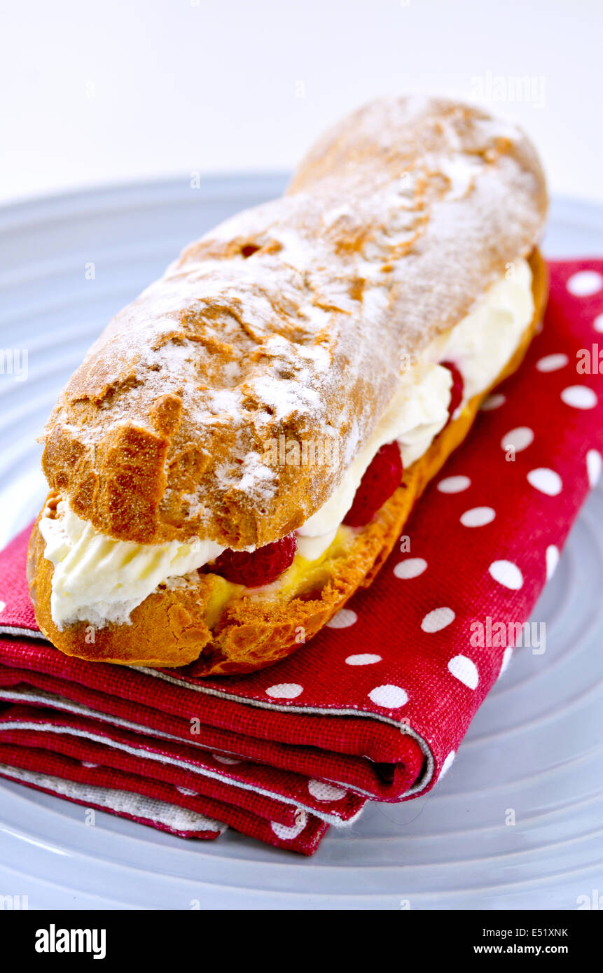 Choux pastry cream eclair slice Stock Photo - Alamy
