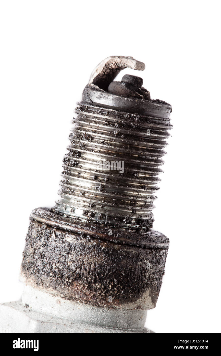 Auto service. Old rusty spark plug as spare part of car transportation ...