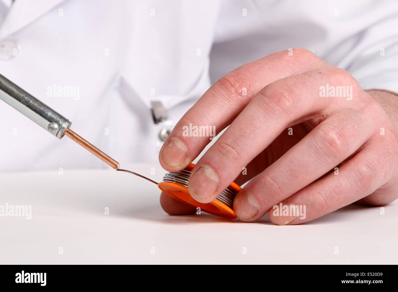 soldering iron in his hand Stock Photo - Alamy