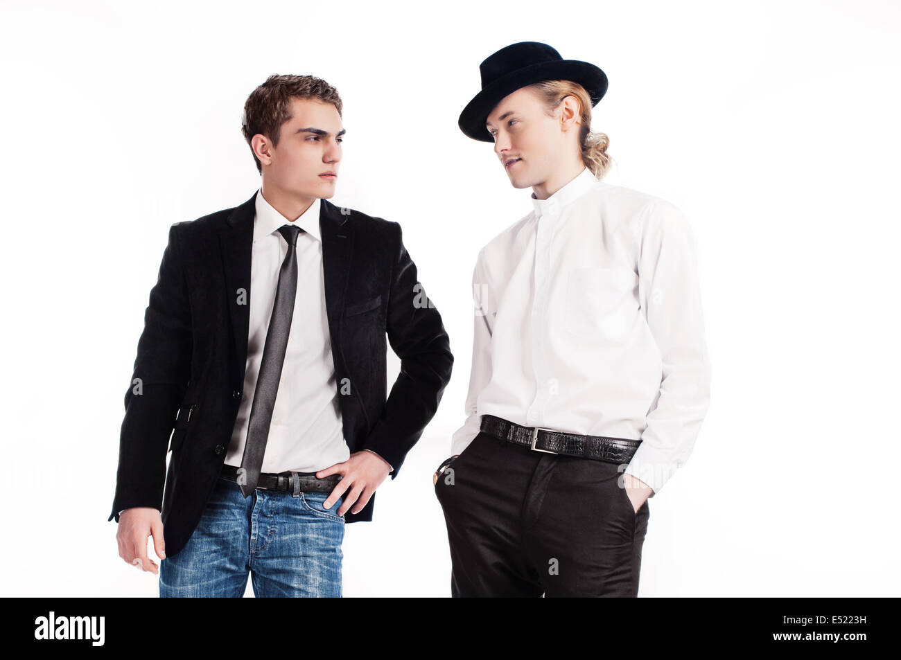 two young men on a white background Stock Photo - Alamy