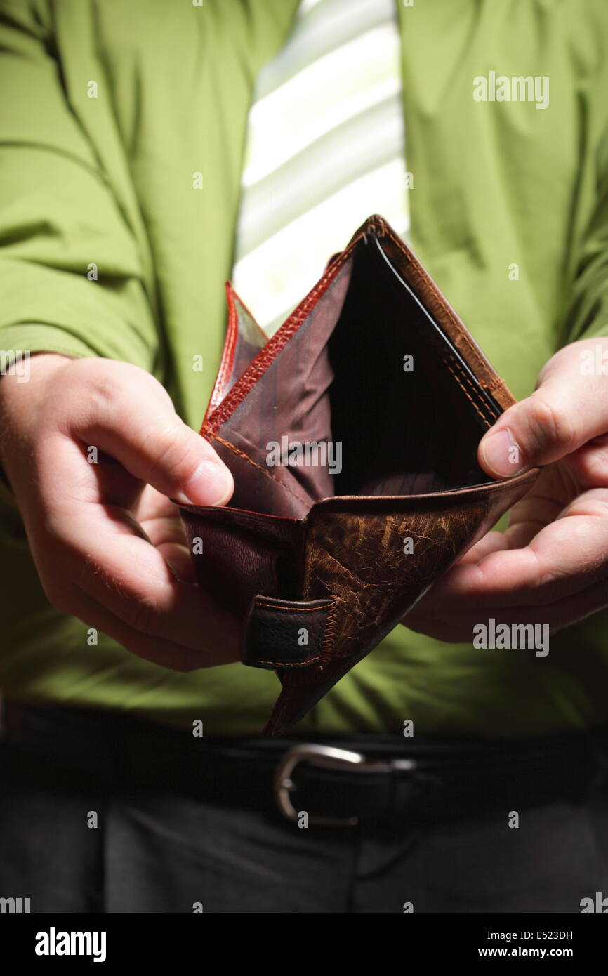 Empty wallet in male hands - poor economy Stock Photo - Alamy