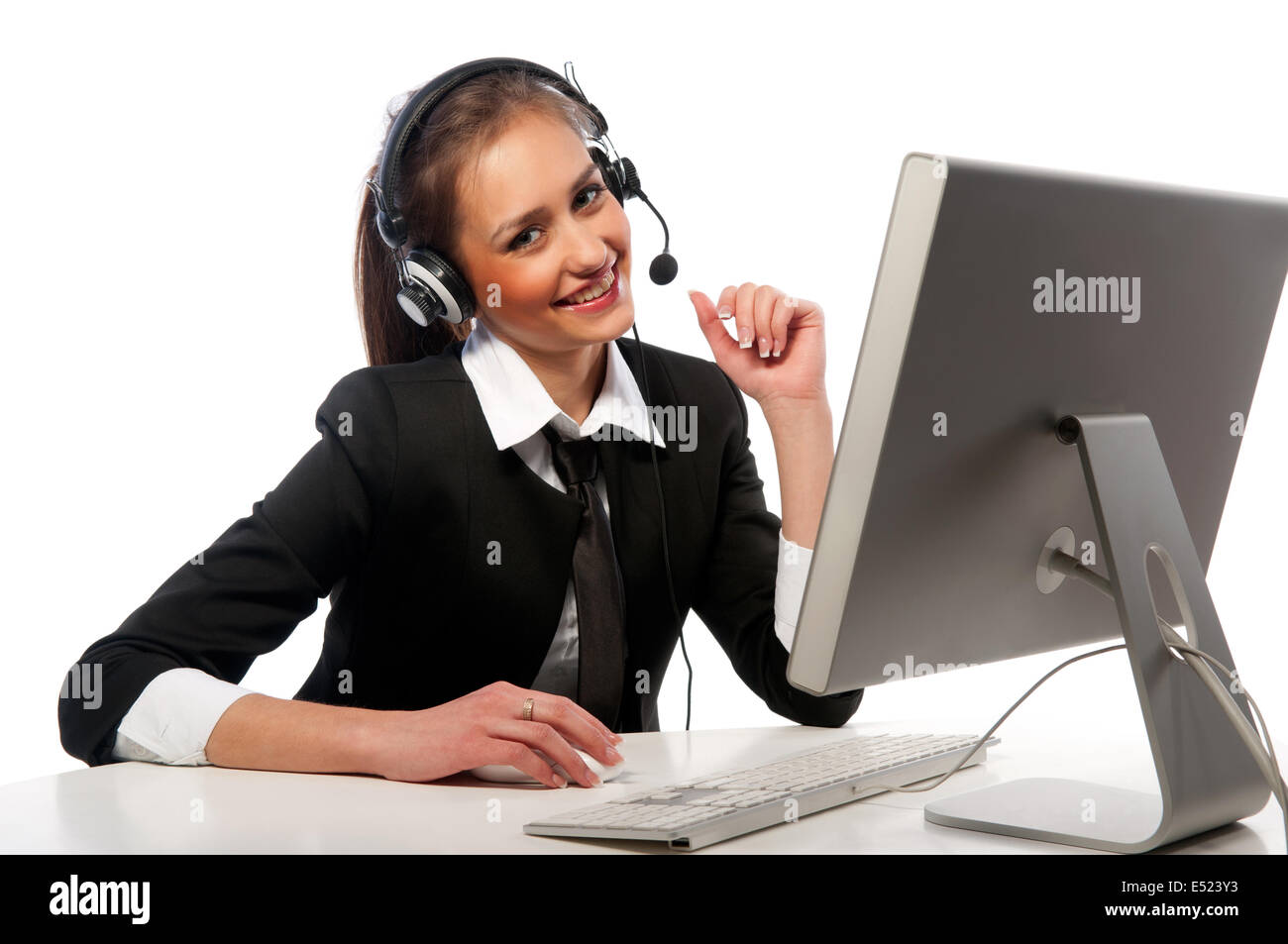 girl with a headset works at the computer Stock Photo - Alamy