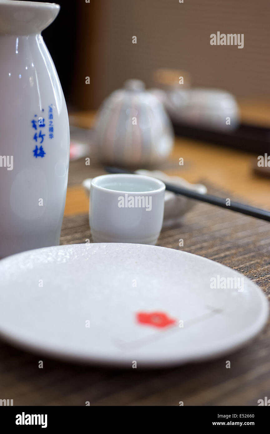 Japanese style table set and sake bottle and cup Stock Photo - Alamy