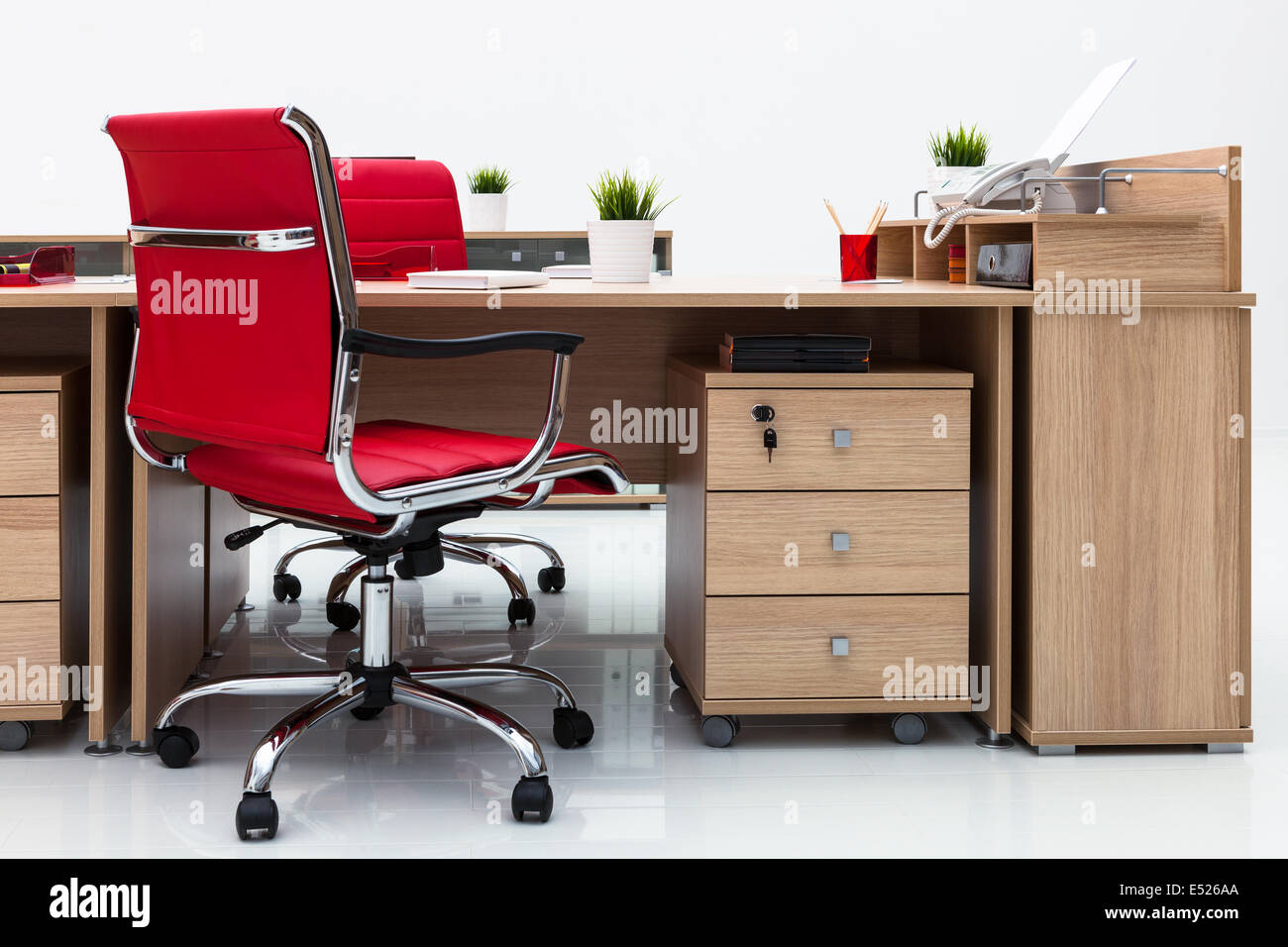 Red desks hi-res stock photography and images - Alamy