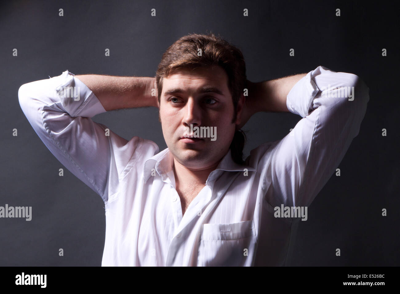 man posing in white shirt Stock Photo - Alamy