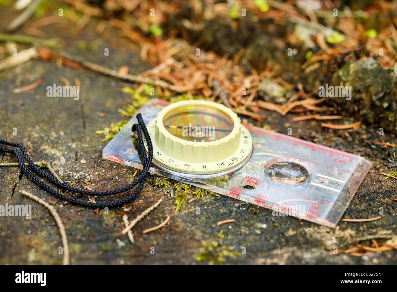 old touristic handheld compass on groung outdoor Stock Photo - Alamy