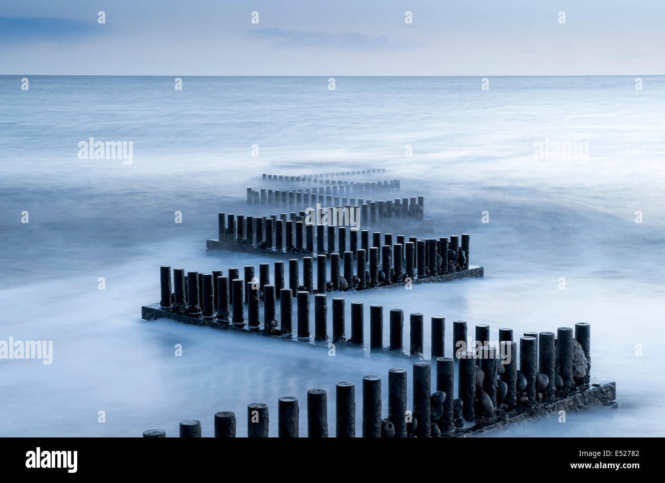 A metal groyne zig zags into the sea on Caister beach Stock Photo - Alamy