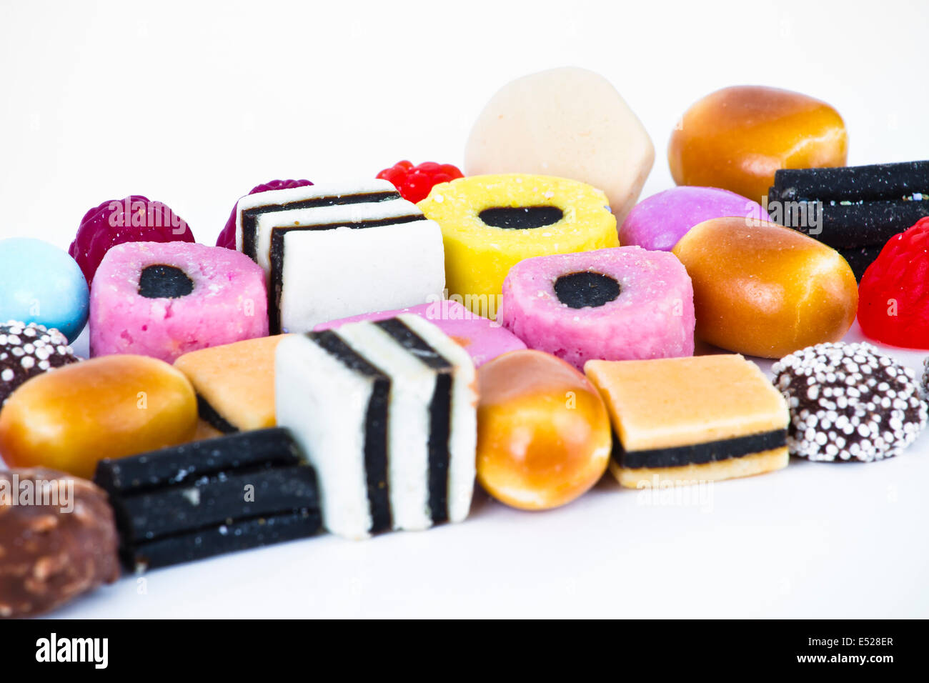 Many candy on white background Stock Photo - Alamy