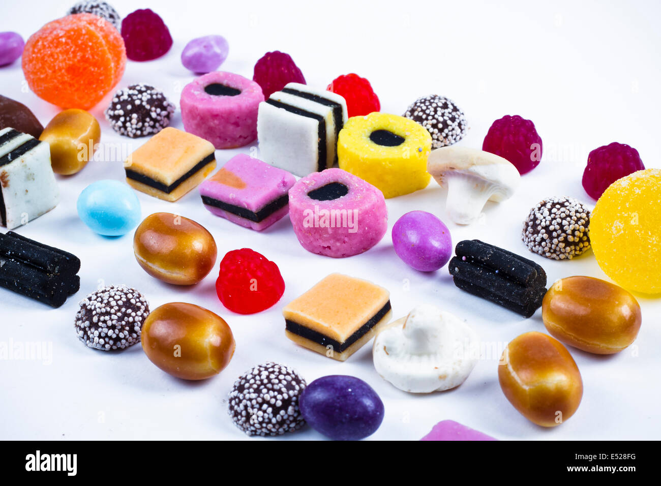 Many candy on white background Stock Photo - Alamy
