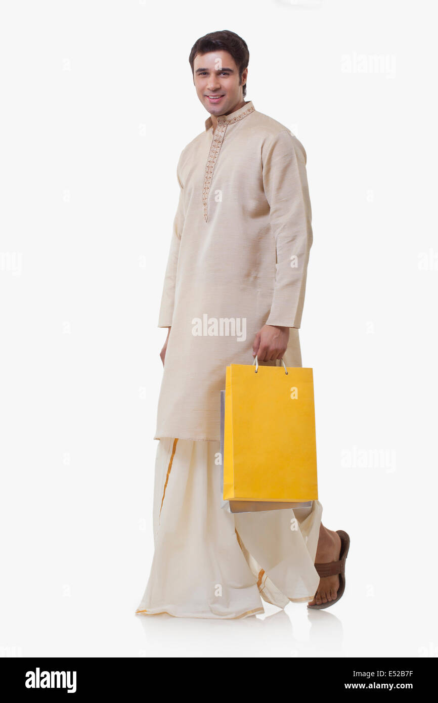 Portrait of a Bengali man holding shopping bags Stock Photo - Alamy