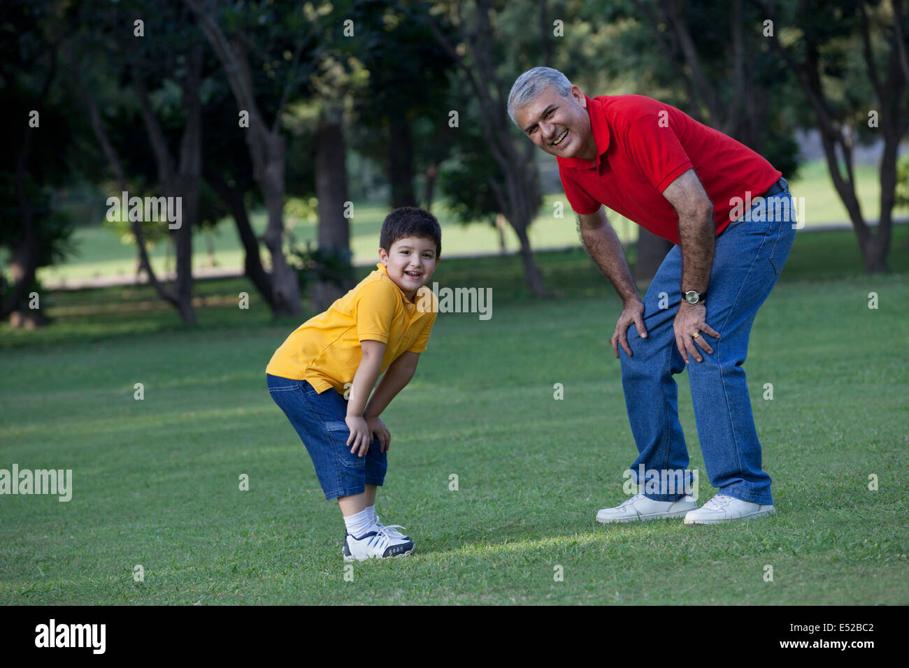 Portrait of grandfather and grandson enjoying in a park Stock Photo - Alamy