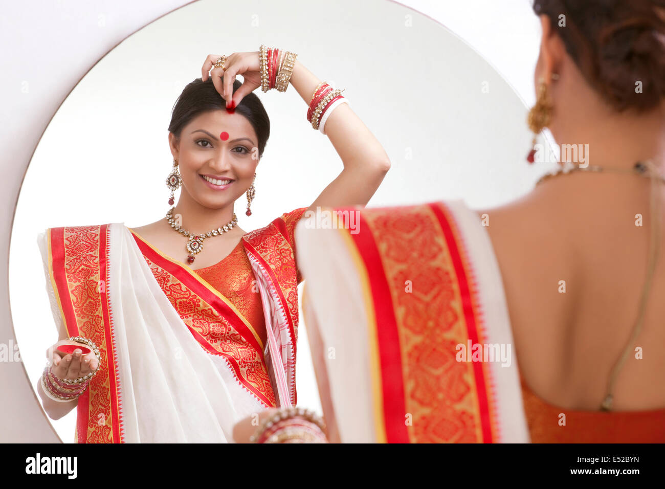 Woman applying sindoor hi-res stock photography and images - Alamy