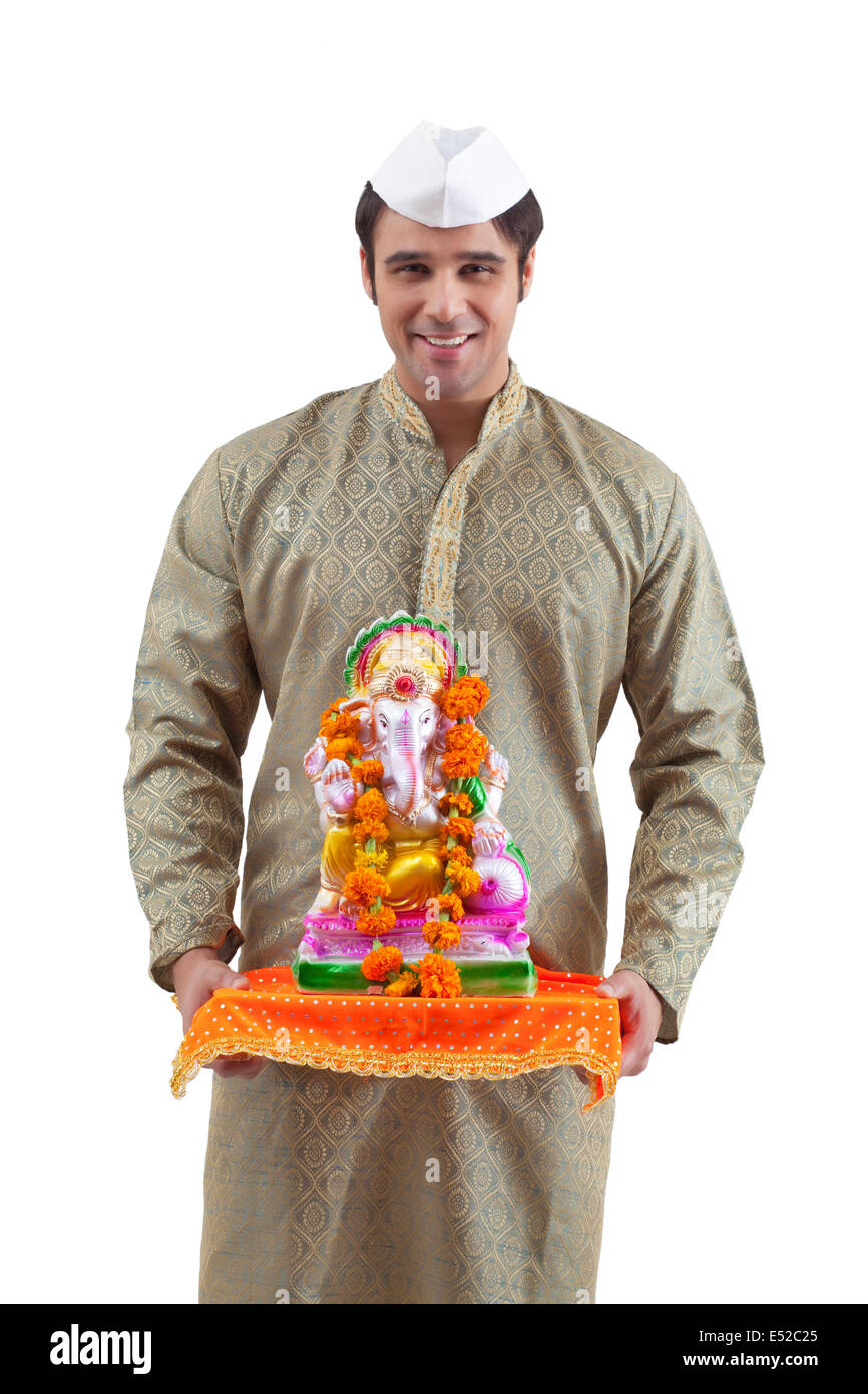 Portrait of a Maharashtrian man holding a Ganesh idol Stock Photo - Alamy