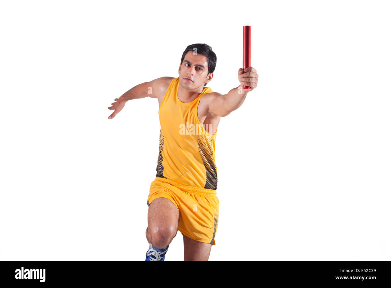 Young male relay runner isolated over white background Stock Photo - Alamy