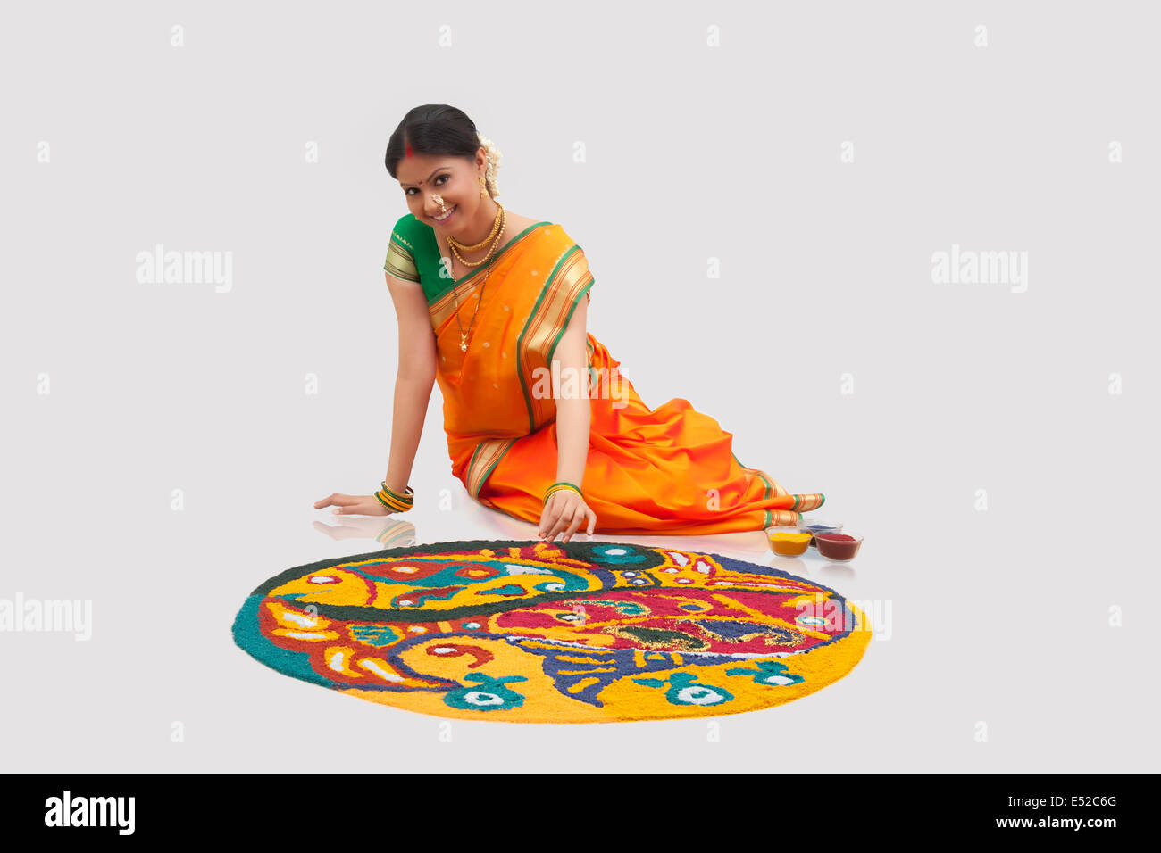 Portrait of Maharashtrian woman making a rangoli Stock Photo - Alamy