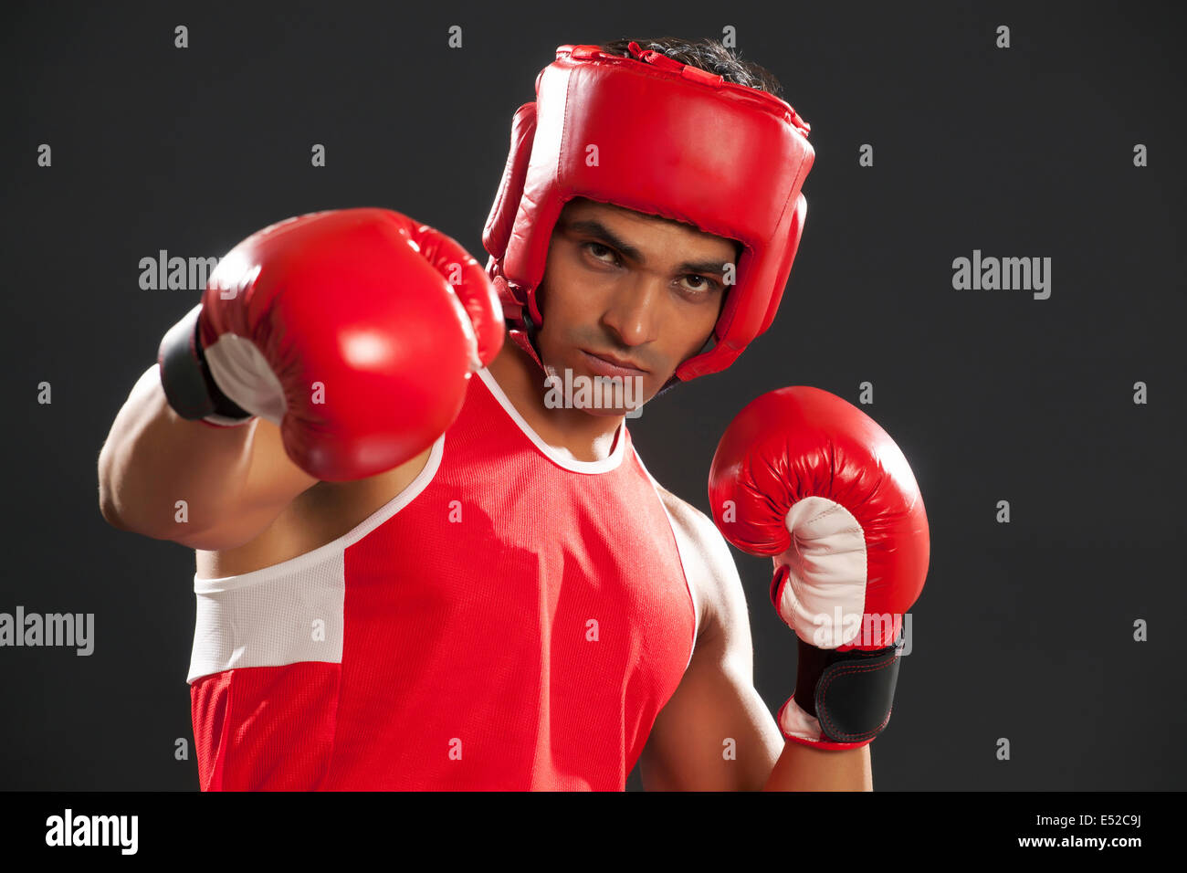 Portrait male boxer punching camera hi-res stock photography and images ...