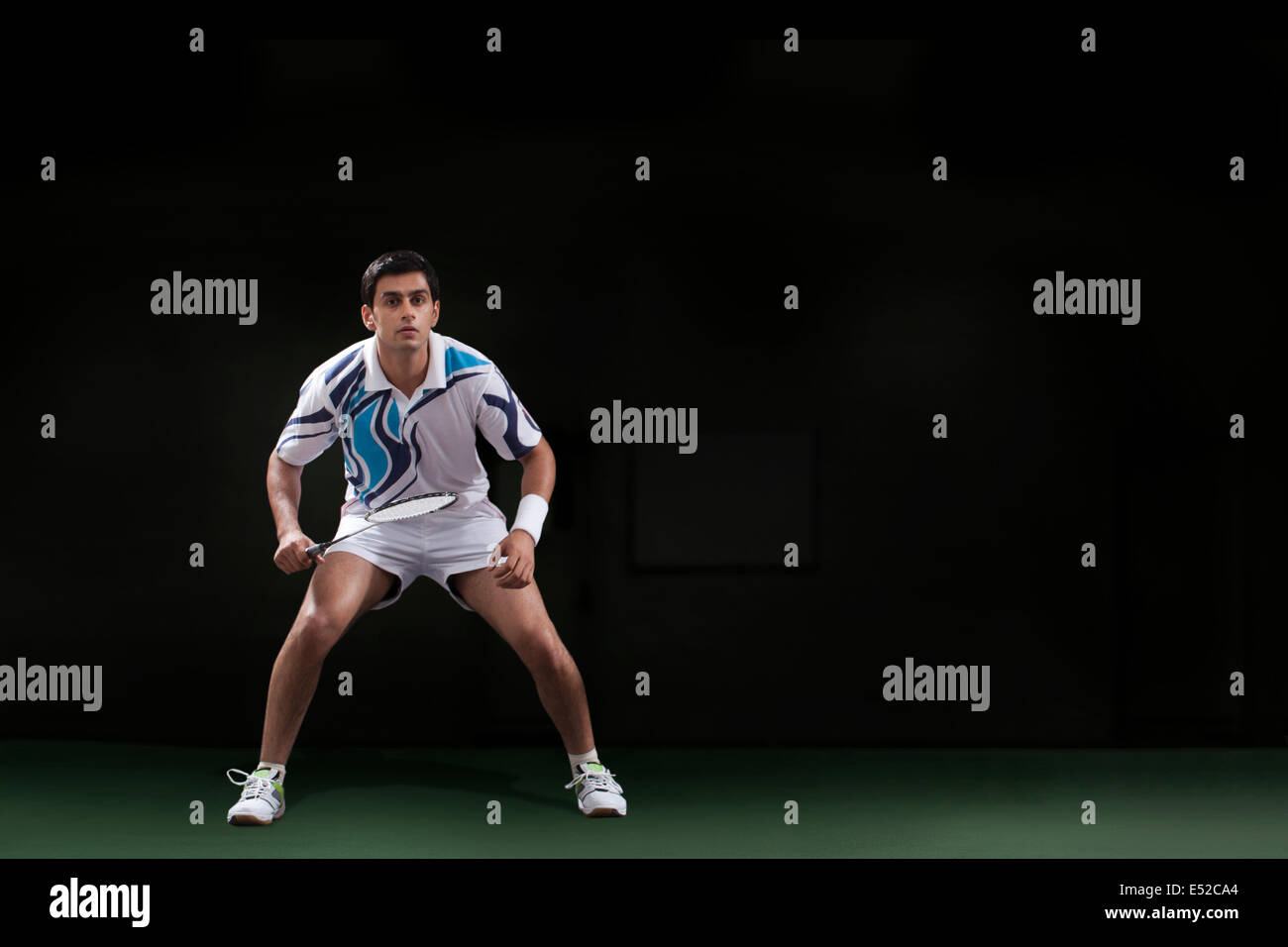 Man with badminton racket hi-res stock photography and images - Alamy