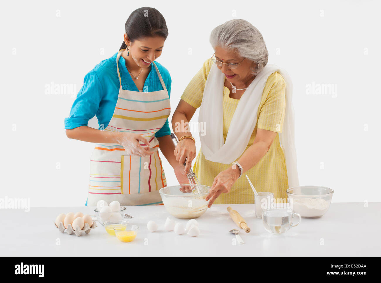 Grandmother and granddaughter working in the kitchen Stock Photo - Alamy