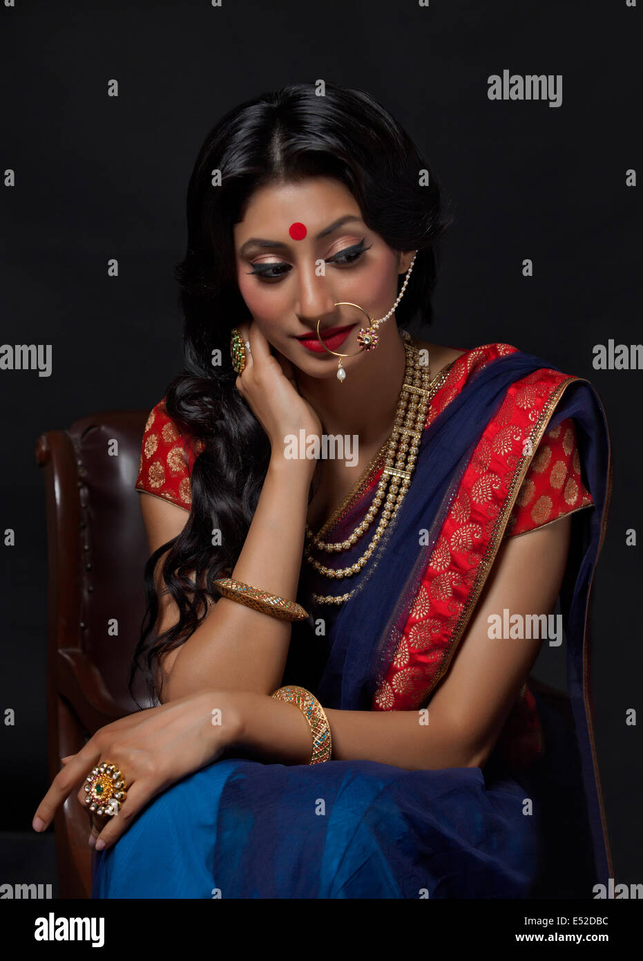 Indian bride sitting on chair hi-res stock photography and images - Alamy