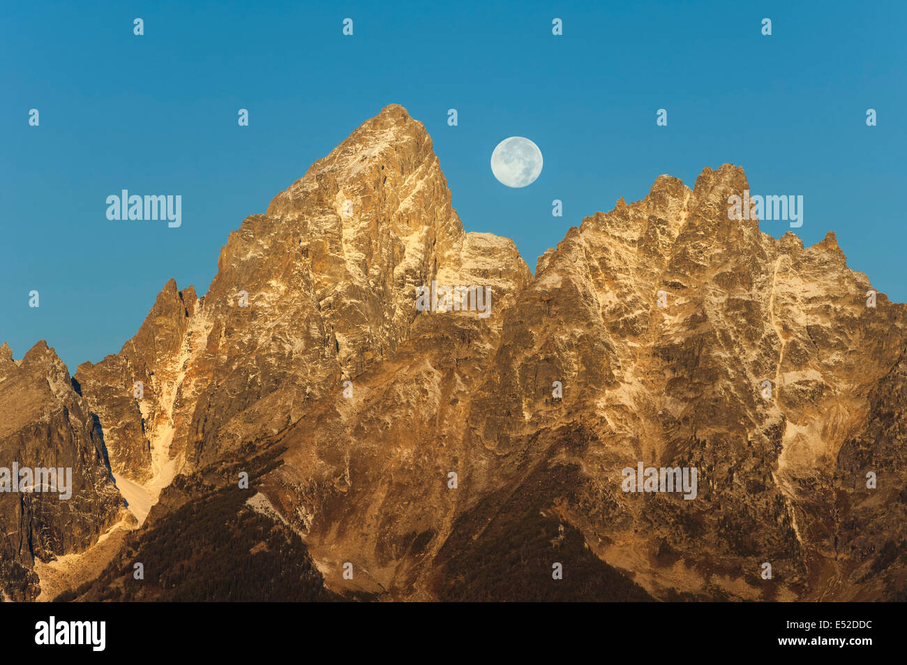 A jagged mountain range in the Grand Teton national park at night, with ...