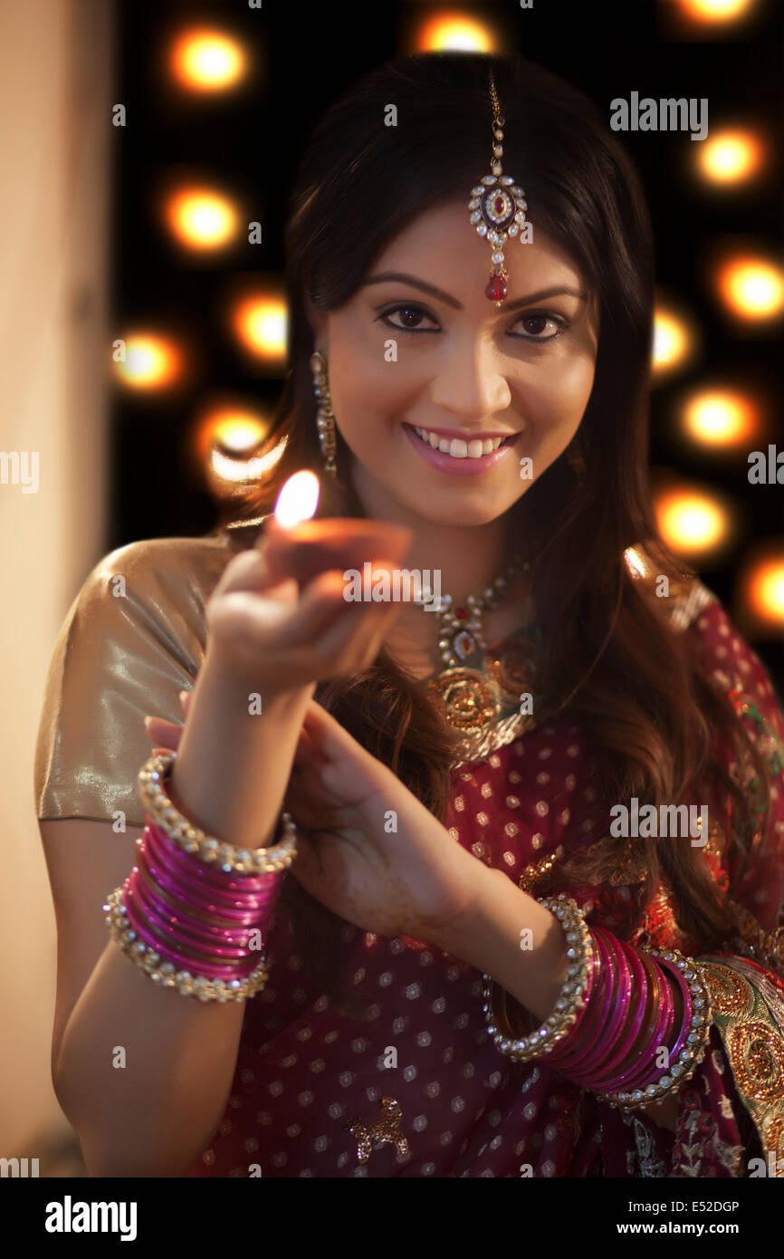 Portrait of woman with a diya Stock Photo - Alamy