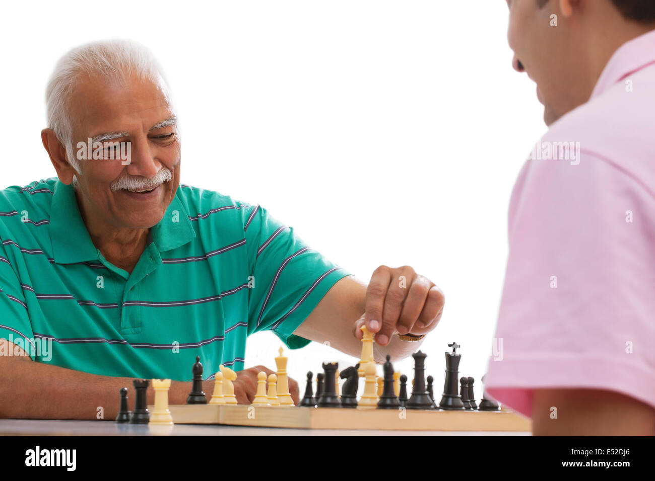 Grandfather and grandson playing chess Stock Photo - Alamy