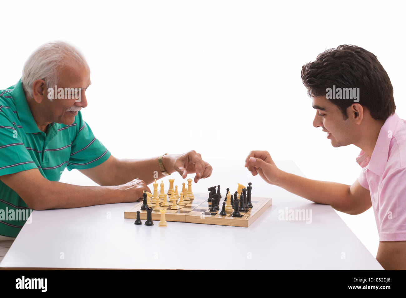 Grandfather and grandson playing chess Stock Photo - Alamy