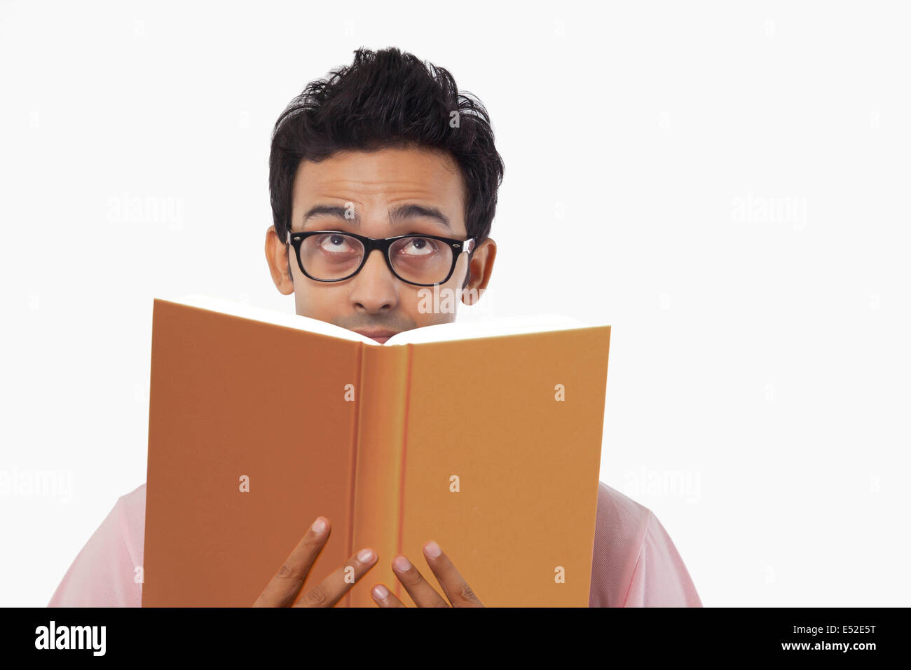 Young man with a book Stock Photo - Alamy