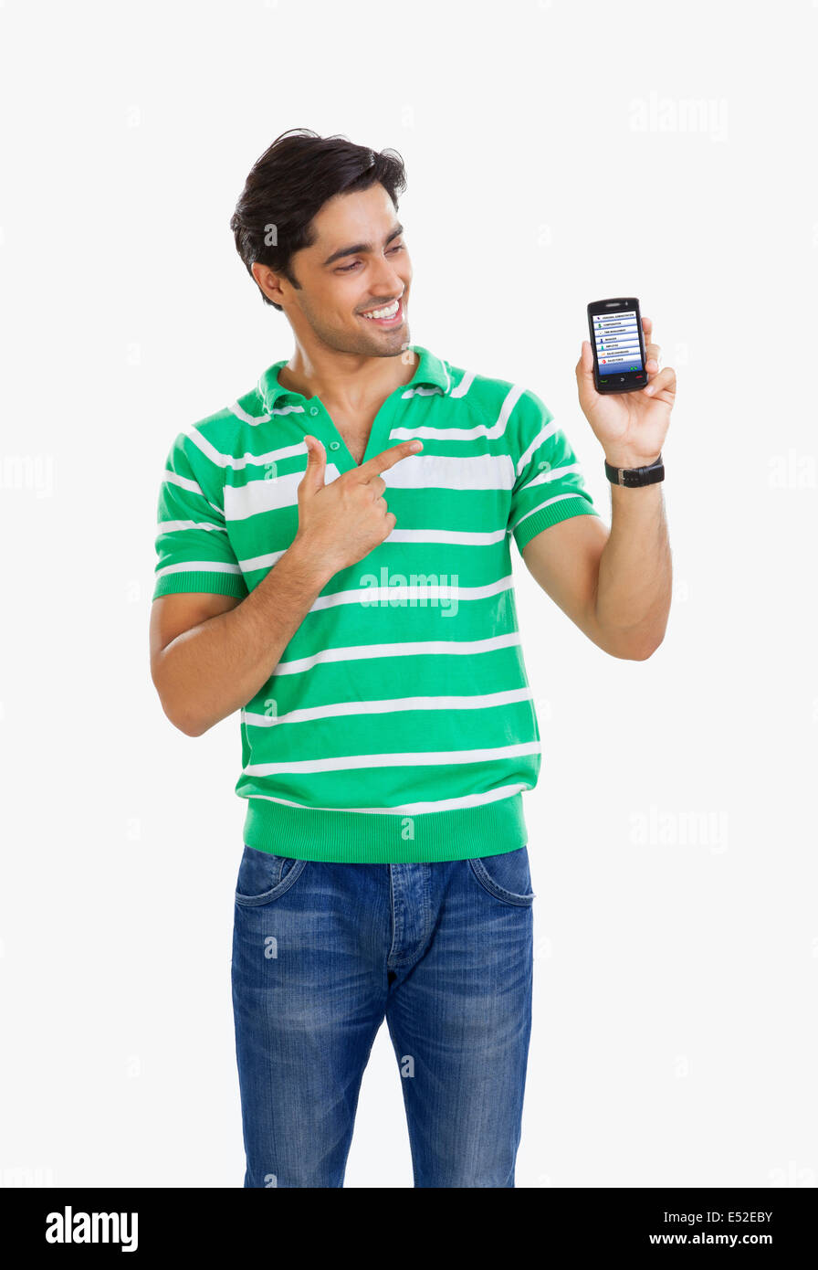Young man pointing to mobile phone Stock Photo - Alamy