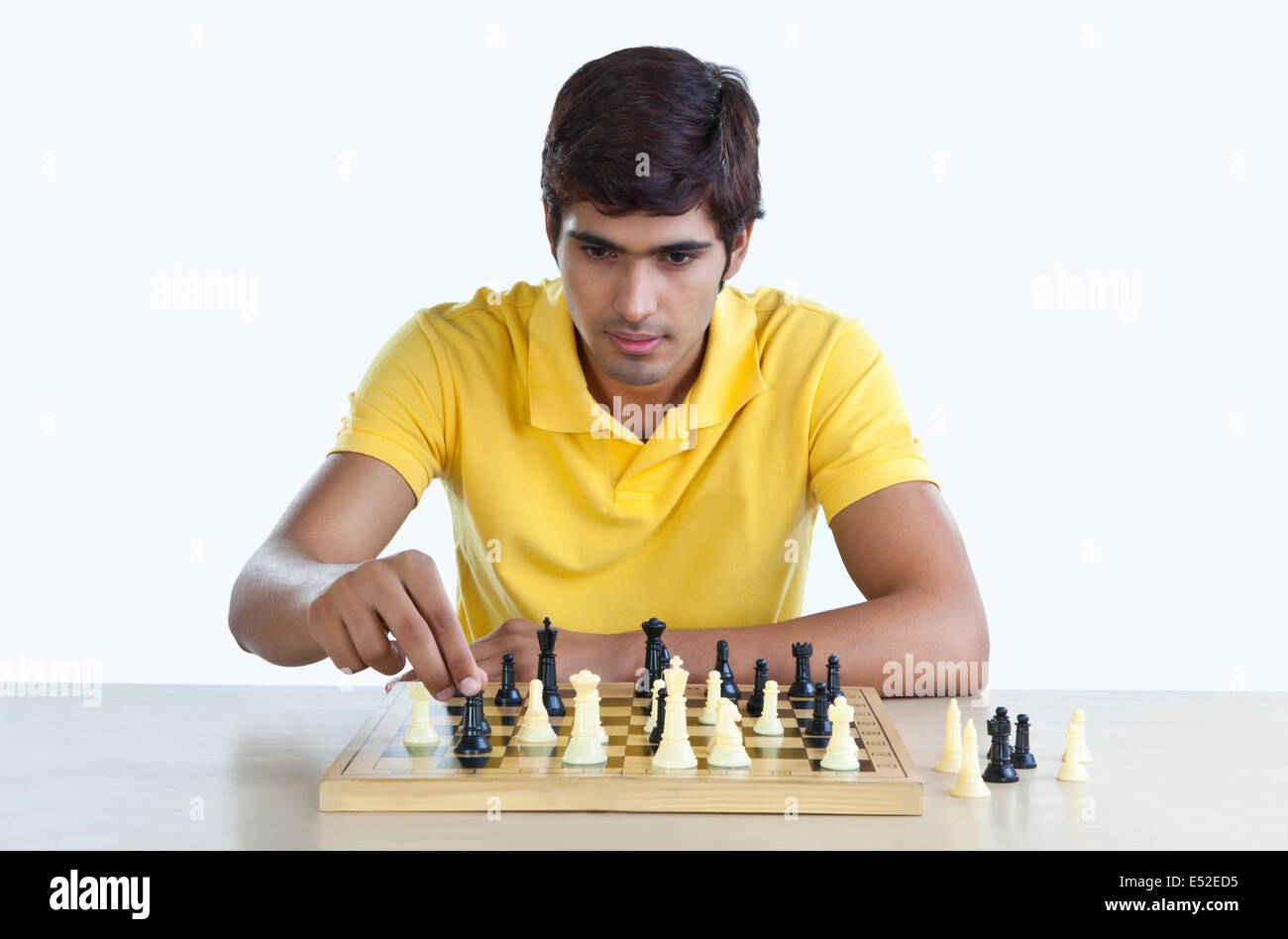 Young man playing chess Stock Photo - Alamy