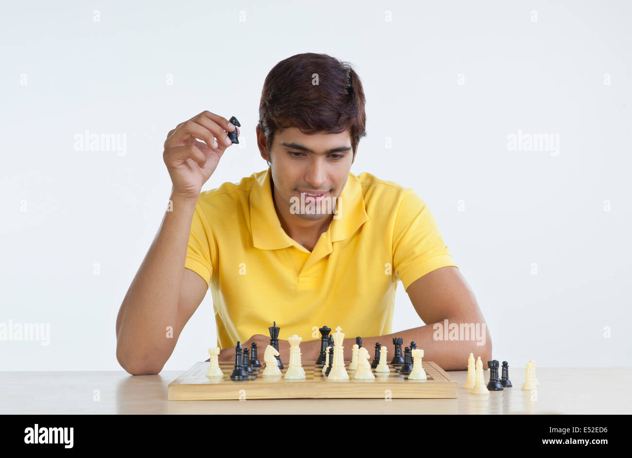 Young man playing chess Stock Photo - Alamy
