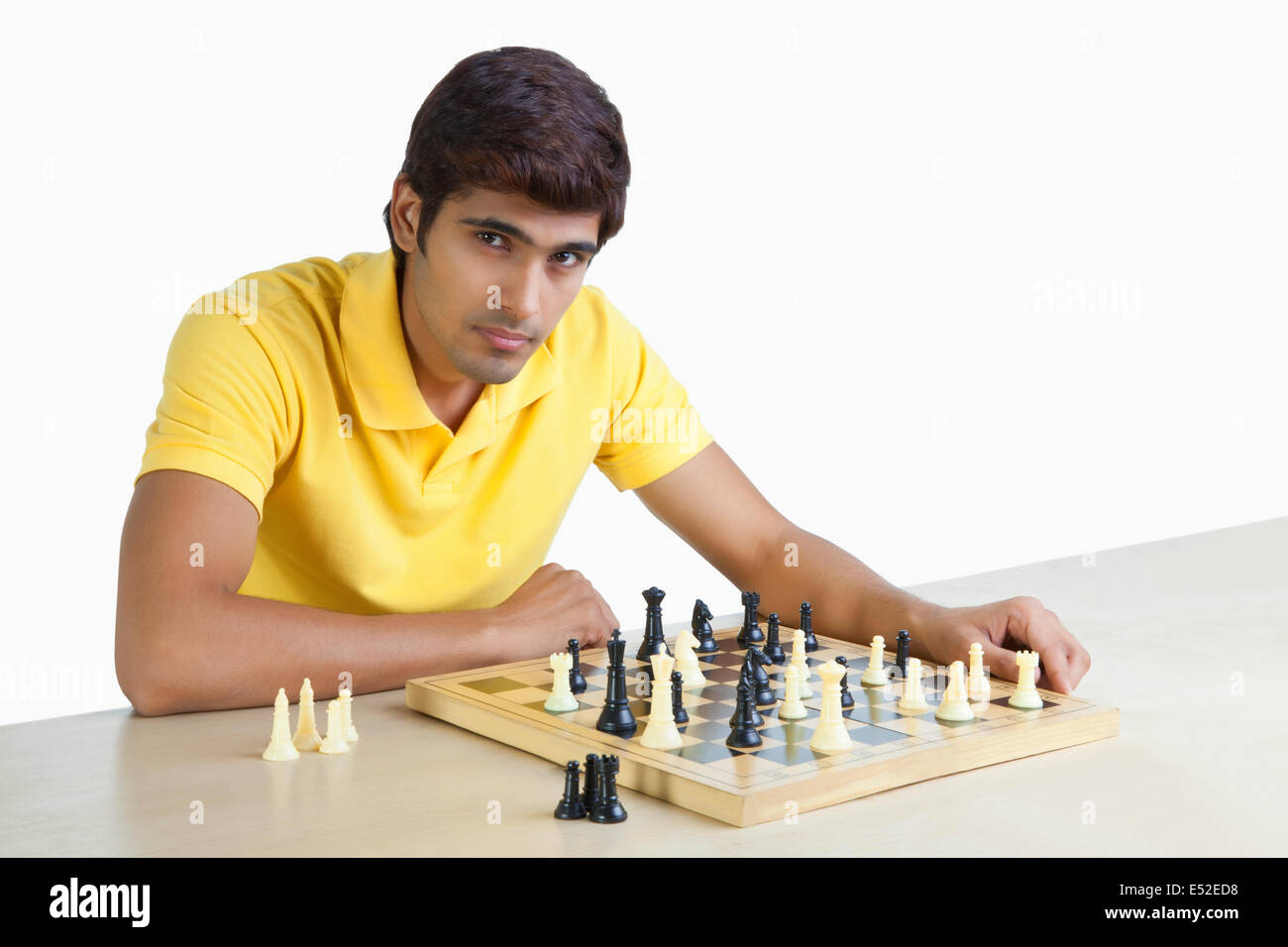 Portrait of a young man playing chess Stock Photo - Alamy