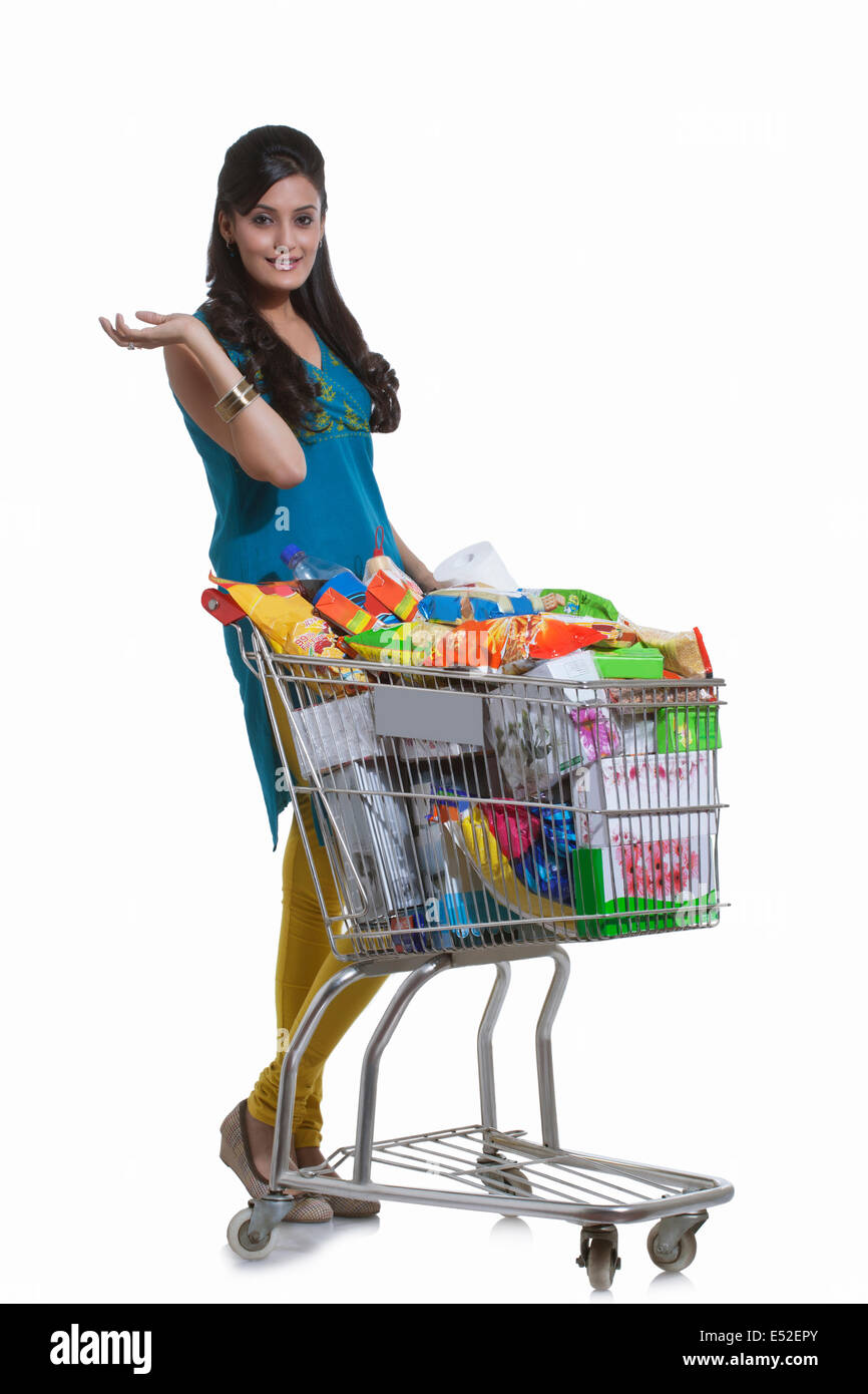 Woman shopping cart products Cut Out Stock Images & Pictures - Alamy