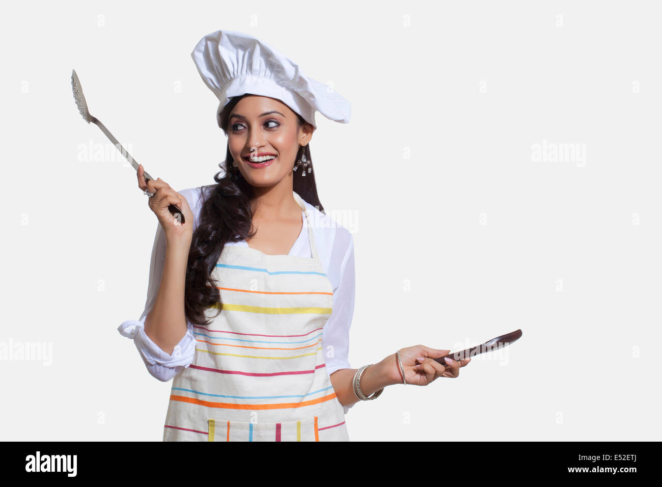 Female chef with cooking utensils Stock Photo - Alamy