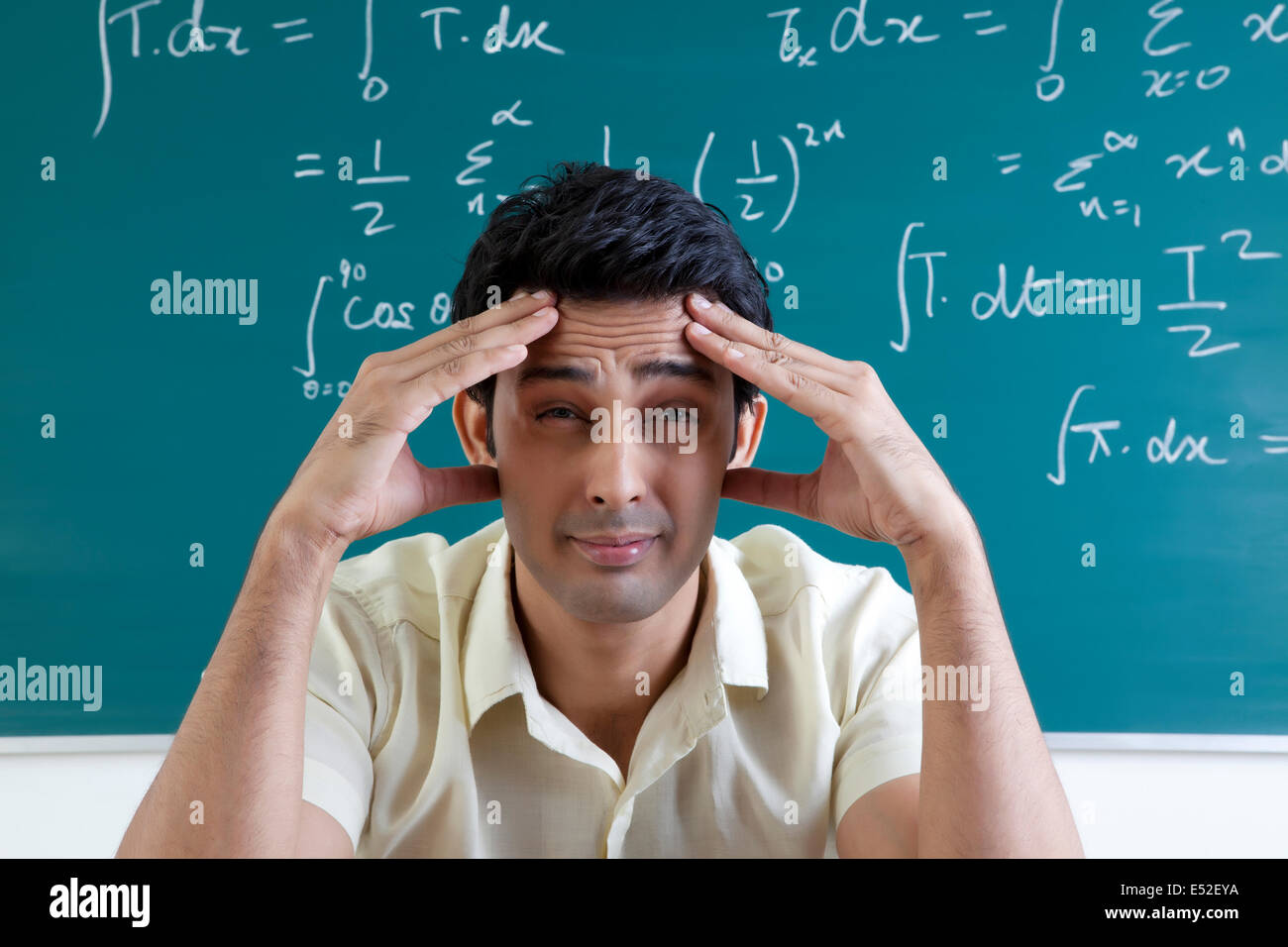 College student getting a headache Stock Photo - Alamy