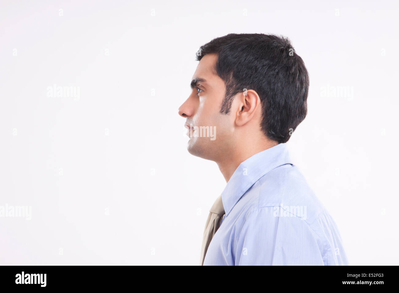 Side view of businessman against white background Stock Photo - Alamy