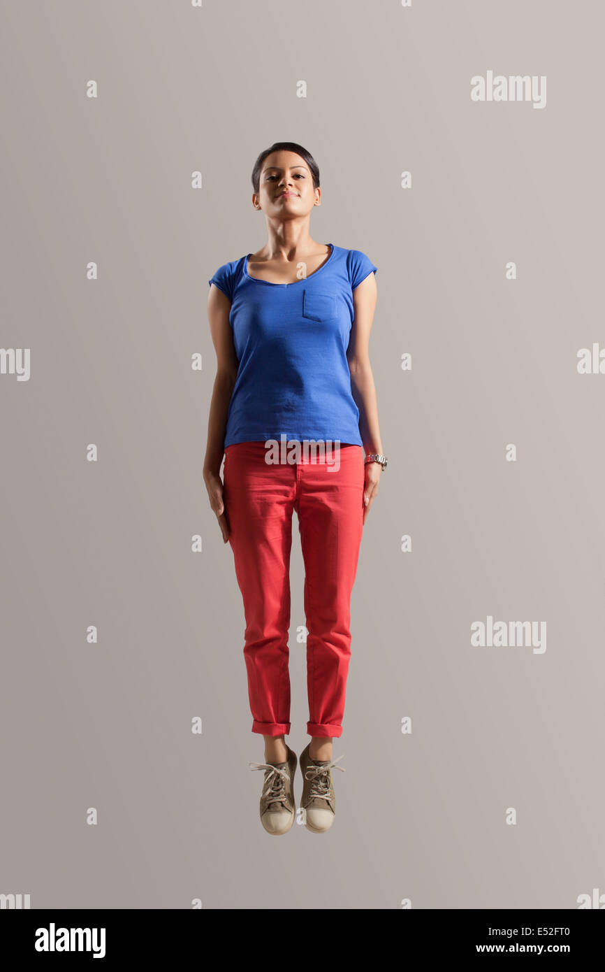 Teenager jumping front view female hi-res stock photography and images ...