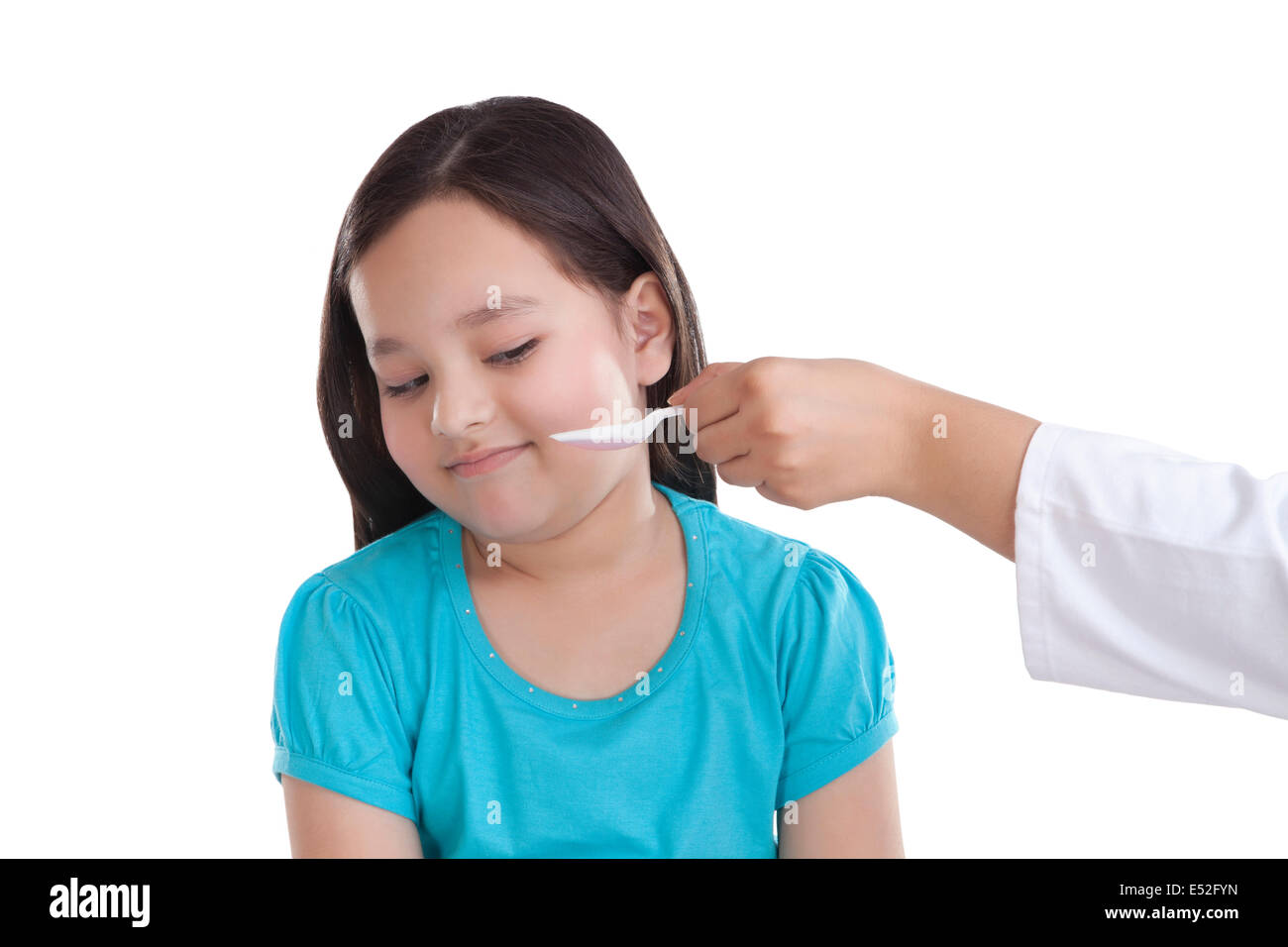 Little girl refusing to have medicine Stock Photo - Alamy