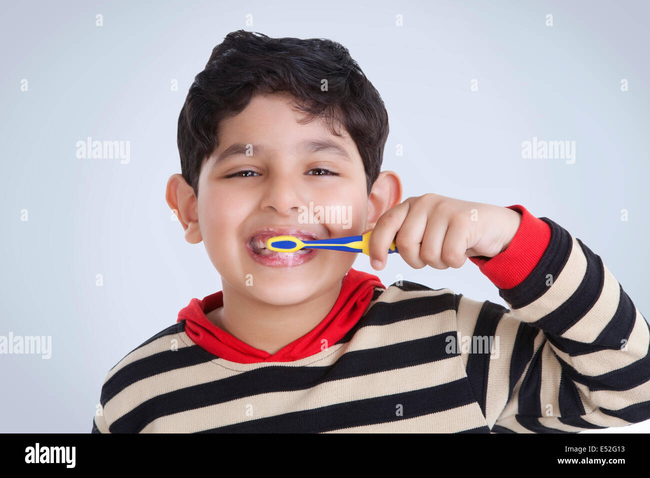 Indian child brushing teeth hi-res stock photography and images - Alamy
