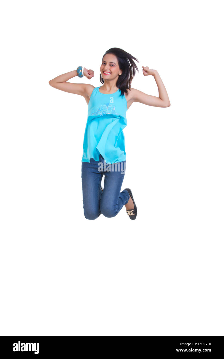 Full length of excited young woman jumping isolated over white ...
