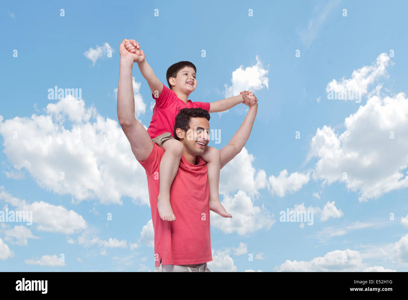 Father carrying child on shoulders hi-res stock photography and images ...