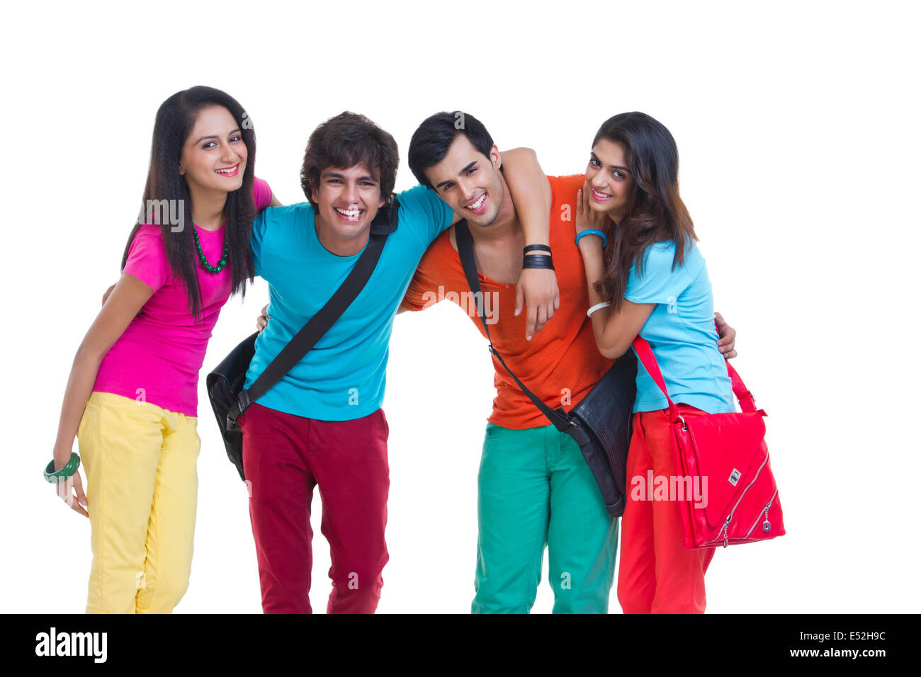 Portrait of university students smiling together over white background ...