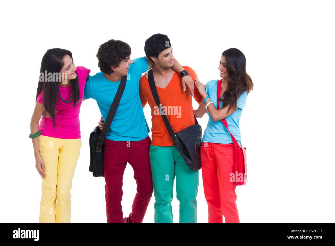 University students smiling together over white background Stock Photo ...