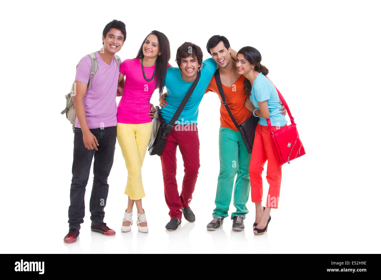 Full length portrait of university students smiling together over white ...