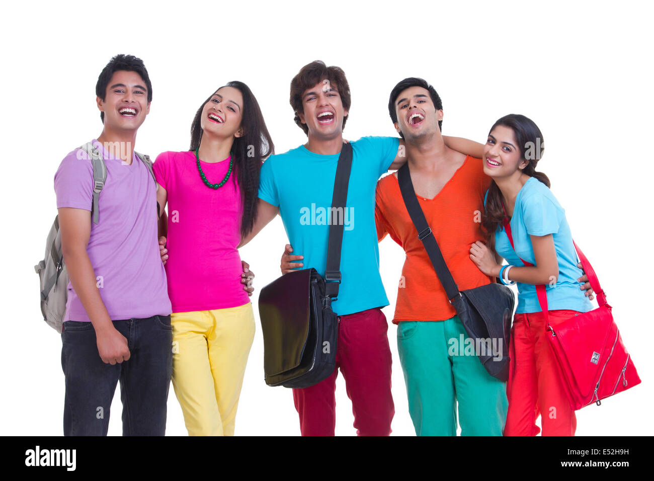 Cheerful university friends standing isolated over white background ...