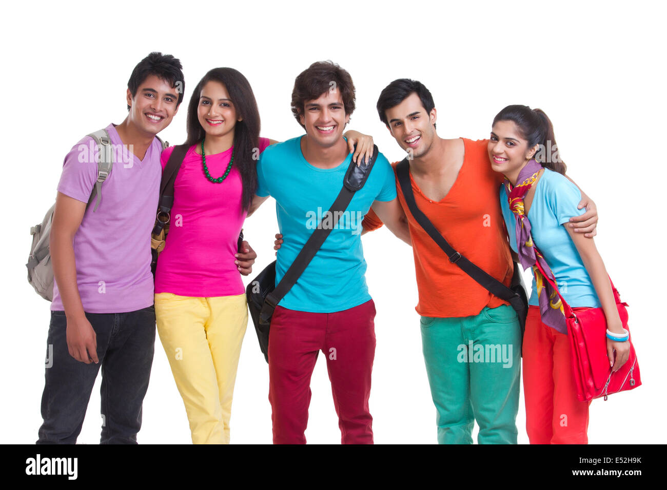 Portrait of happy young friends standing isolated over white background ...