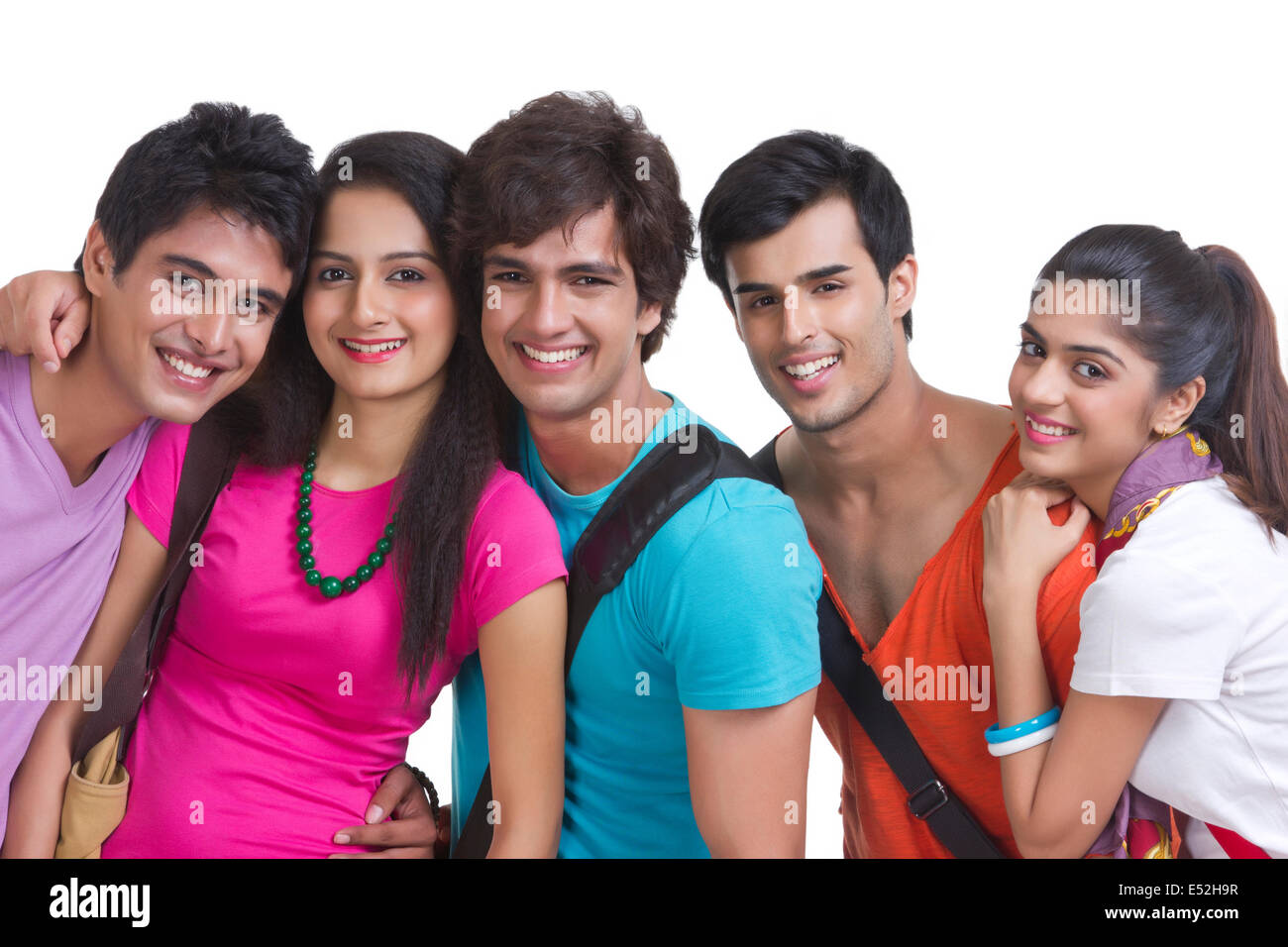 Portrait of university friends standing together over white background ...